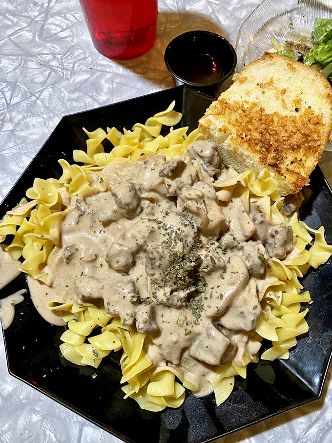 Beef stroganoff that your grandmother would approve of, nestled on egg noodles like a savory blanket of comfort.