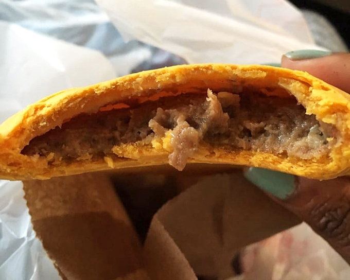 Bite into this beef patty and discover the universe of flavor hiding inside that golden, flaky pastry shell.