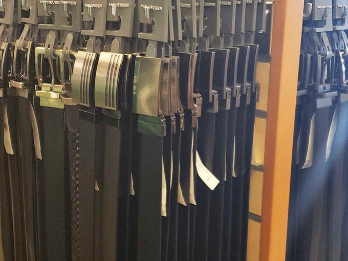 A lineup of belts hangs with military precision, each one promising to be the unsung hero of countless future outfits.