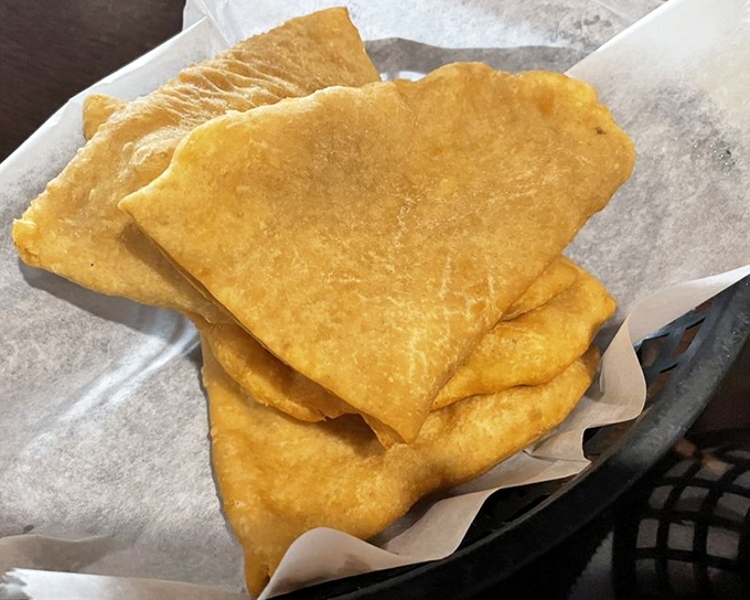 Golden, puffy bhatura bread that's part pillow, part magic carpet—ready to transport you to flavor town with each tear and dip.