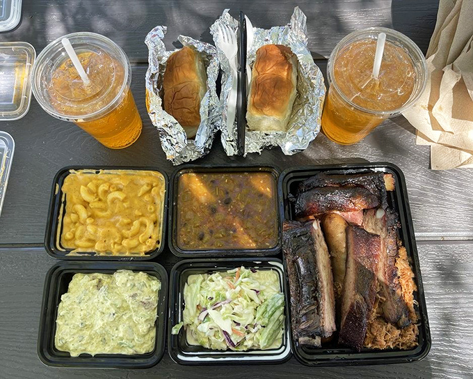 This isn't just a meal&mdash;it's a barbecue festival on a tray. Mac and cheese, green chili, rolls, and meat that's been kissed by fire.