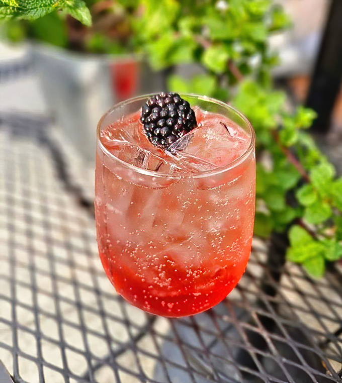 A blackberry cocktail that looks like summer in a glass&mdash;the kind of drink that makes you want to cancel your afternoon plans.