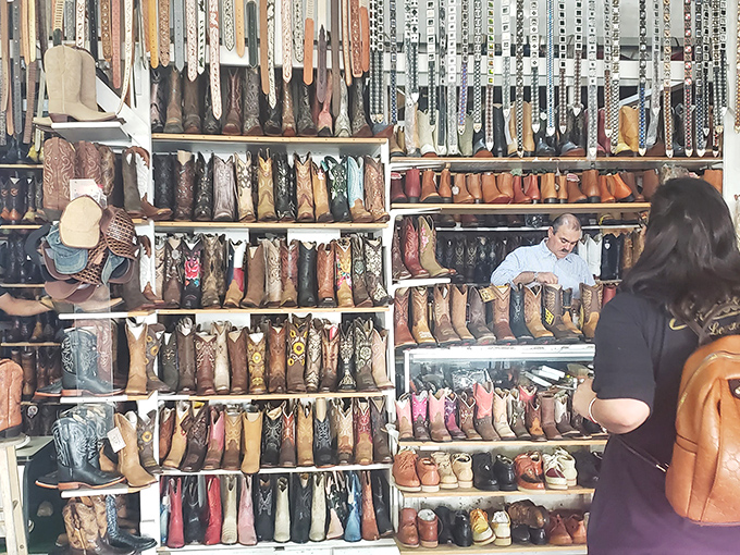 The boot wall of fame! Every Texan's dream closet materialized in one spectacular display of leather craftsmanship and western heritage.