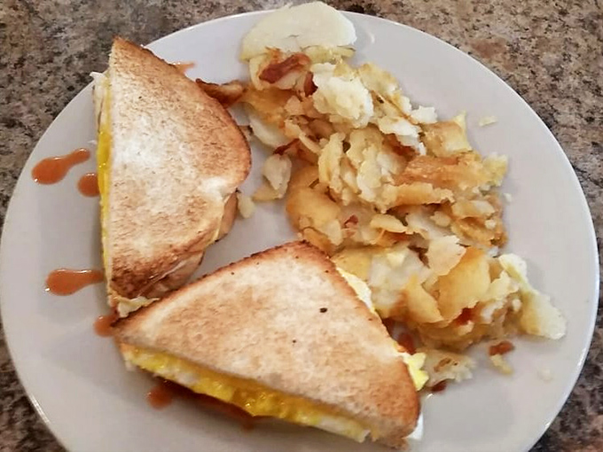 The breakfast sandwich that turns grab-and-go into a gourmet experience wrapped in portable perfection and melted cheese.