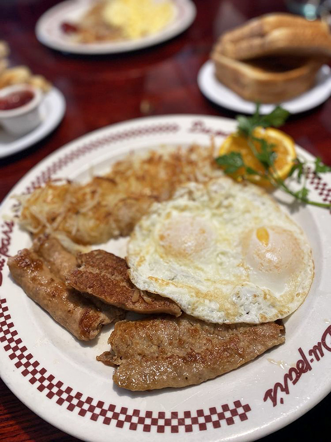The breakfast trinity: perfectly cooked eggs, crispy-edged sausage, and hash browns that have achieved the ideal crisp-to-tender ratio. Morning salvation.