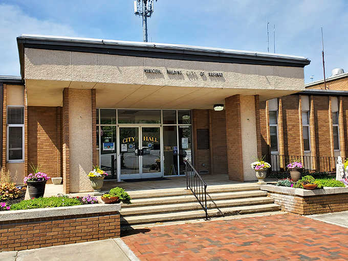 Brevard's City Hall welcomes visitors with colorful flower pots that say "We may handle serious business inside, but we don't take ourselves too seriously."