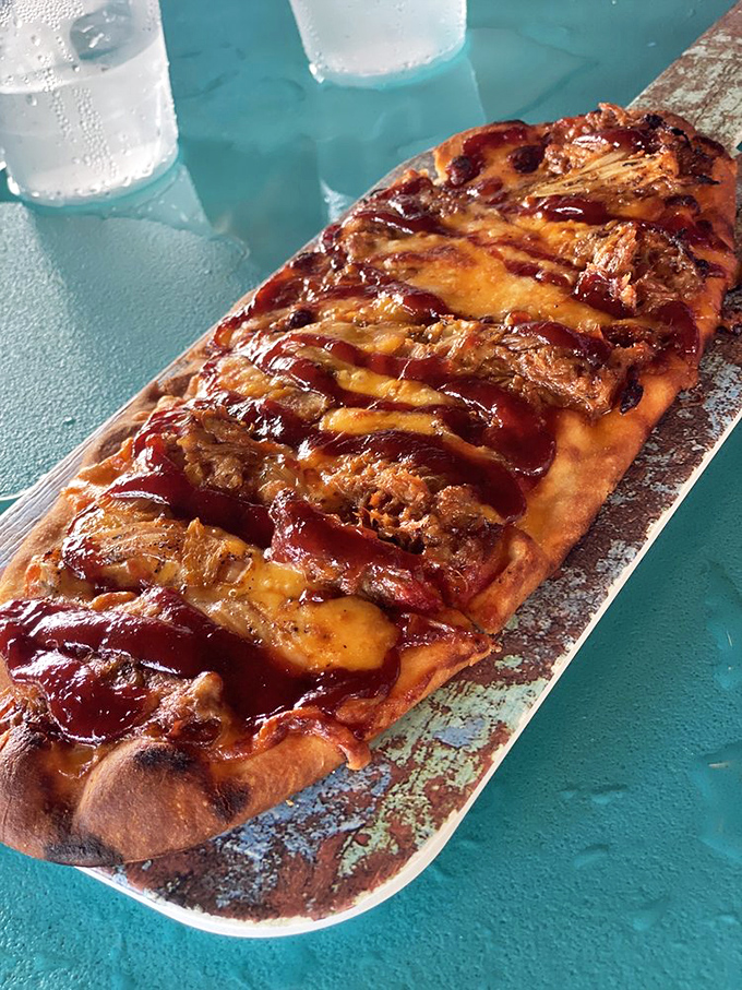 Flatbread or flavor canvas? This brisket-topped creation proves that sometimes the best culinary experiences come on the flattest surfaces.
