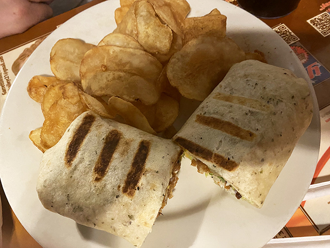 Grilled perfection wrapped in a tortilla. This hearty wrap brings together crispy exterior and savory fillings alongside house-made chips.