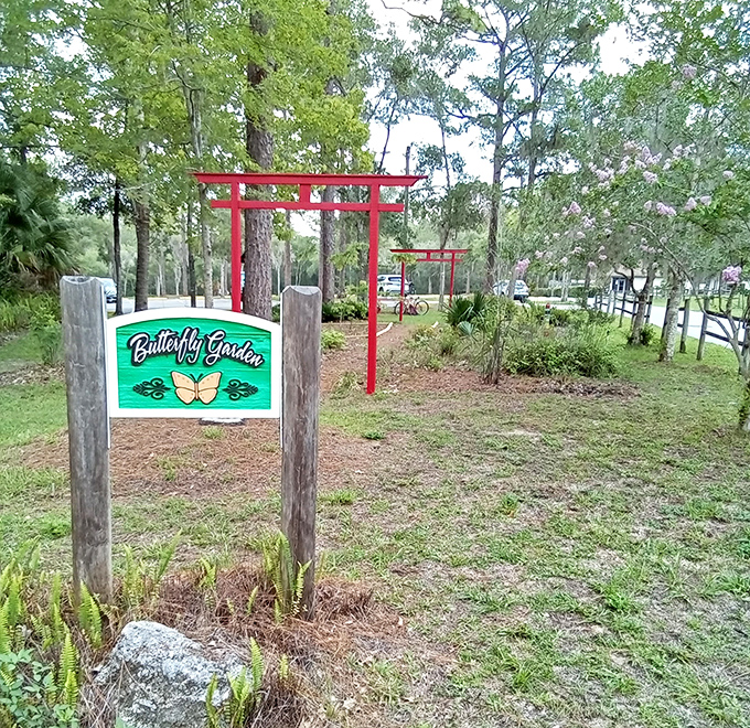 The Butterfly Garden entrance promises winged magic ahead &ndash; nature's free entertainment for those who've learned that the best things aren't things.