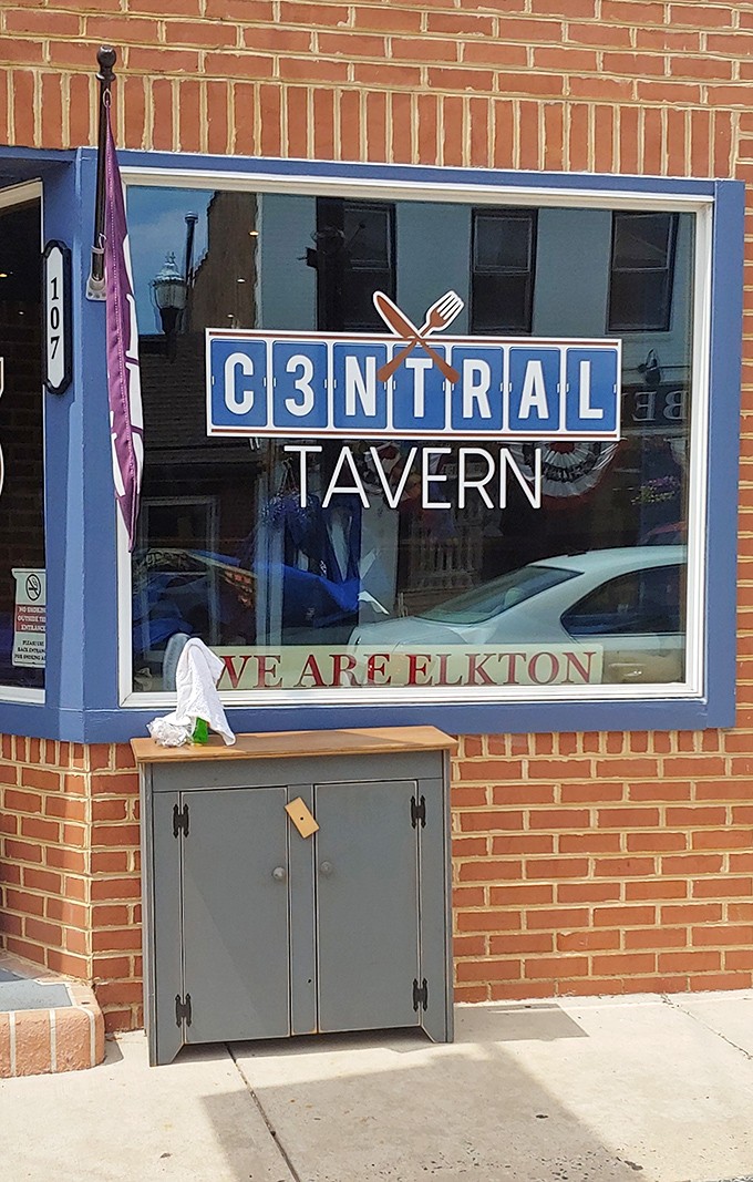 C3ntral Tavern proudly declares "We Are Elkton," serving up local pride alongside their menu in this brick-fronted gathering spot.