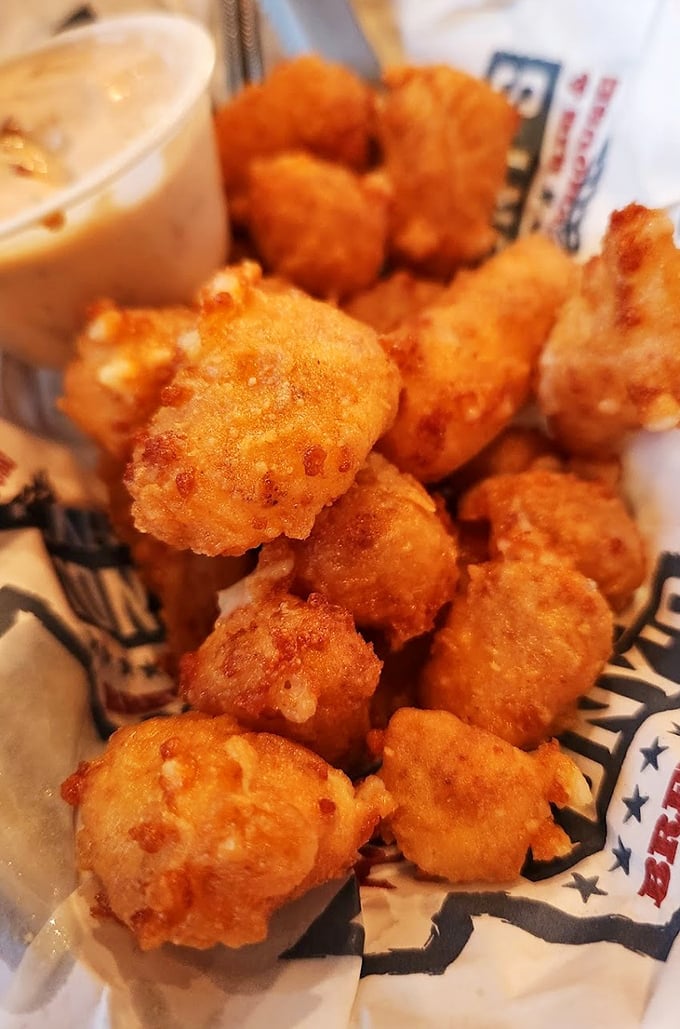 Cheese curds with attitude—golden-fried Wisconsin treasures dusted with Cajun seasoning that make a compelling opening act for the barbecue main event.