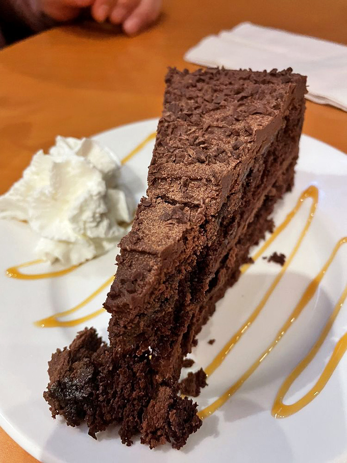 Chocolate cake that doesn't need to show off with unnecessary frills &ndash; just layer upon layer of cocoa perfection with a dollop of whipped cream.