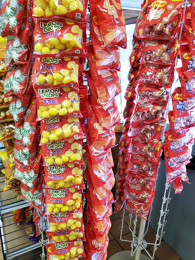 The candy rack &ndash; where childhood memories hang in colorful bags, tempting you to add a sweet finale to your savory feast.
