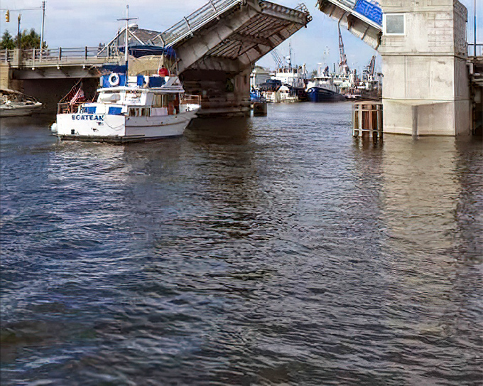 The Cheboygan Bascule Bridge rises like a mechanical ballet, pausing traffic but reminding everyone that on water, boats have the right of way.