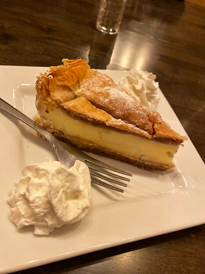 A slice of cheesecake that makes you understand why people commit to gym memberships they'll never use. Worth every glorious calorie.