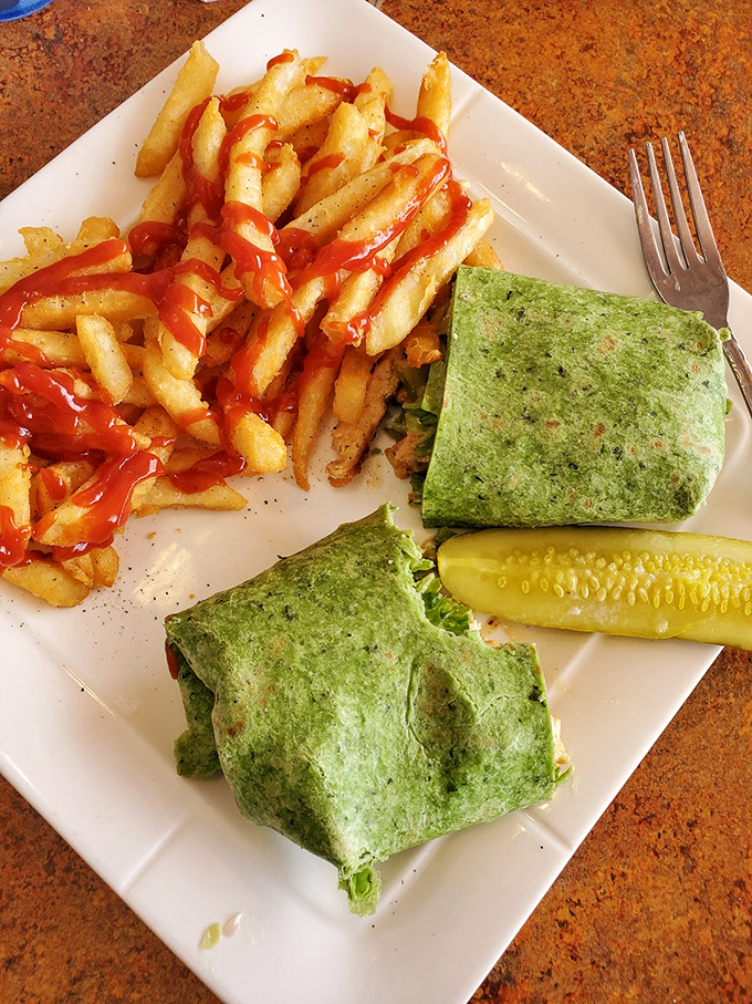 Not all heroes wear capes, but the best ones come wrapped in spinach tortillas with crispy fries. Ketchup artistry included at no extra charge.