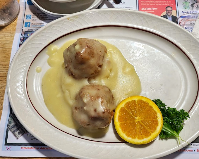 Chicken croquettes swimming in velvety gravy &ndash; comfort food that doesn't just hug your soul, it gives it a warm blanket and tells it everything will be okay.