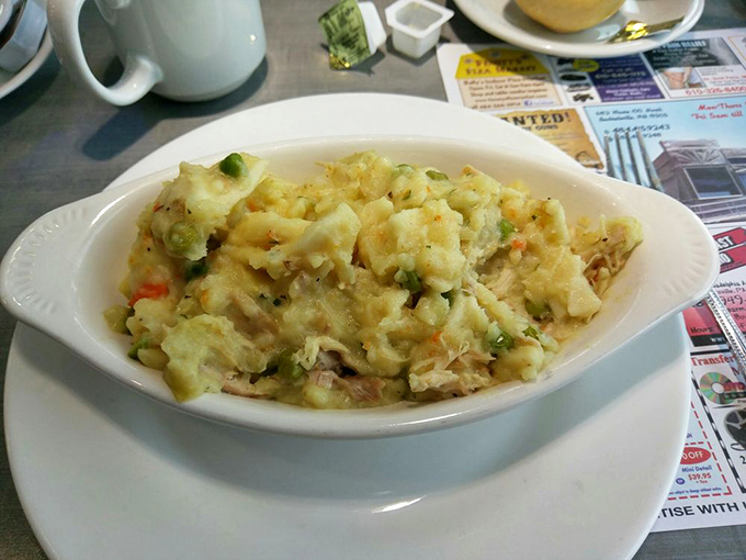 Chicken pot pie that's having an identity crisis as a casserole &ndash; chunks of chicken and vegetables swimming in creamy sauce that screams "home cooking."