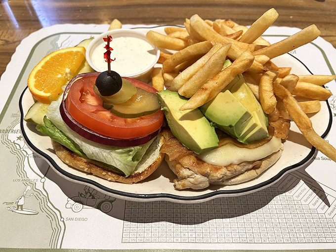 A perfectly constructed sandwich with golden fries&mdash;the kind of roadside meal that makes you grateful for hunger and the invention of bread.