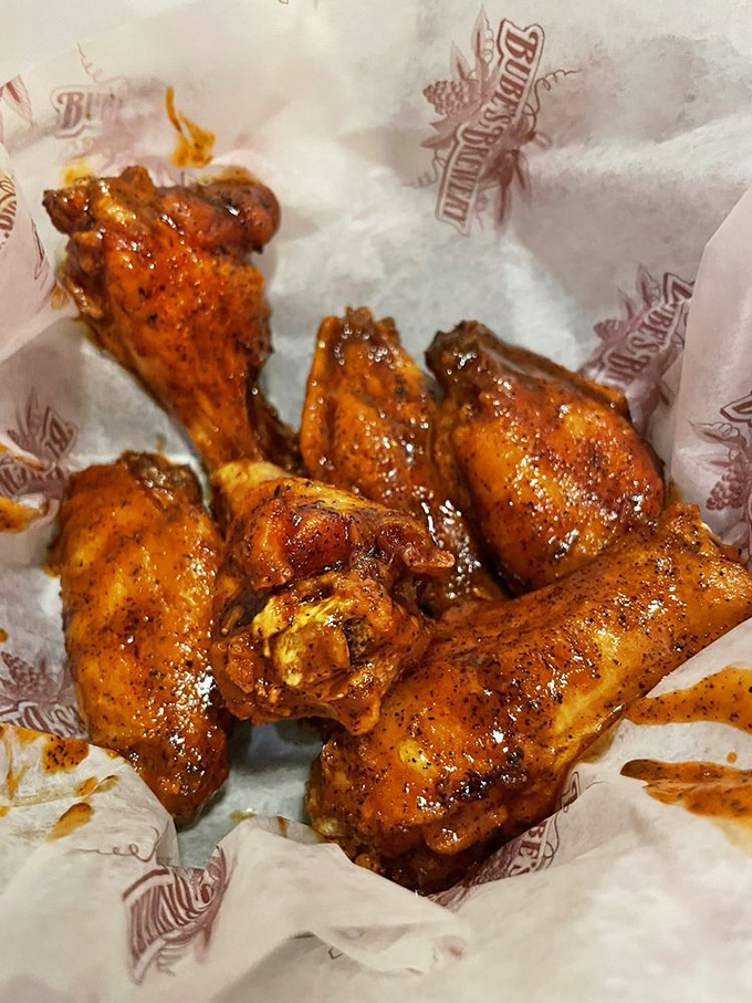 These wings shine with that perfect glaze that makes grown adults forget their table manners.