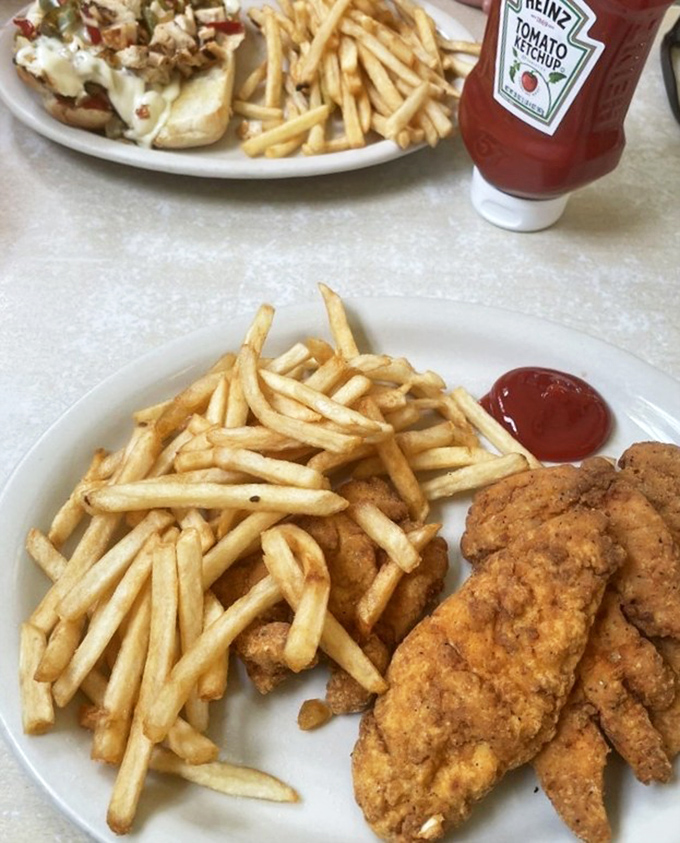 Golden, crispy chicken tenders that put fast food versions to shame. Paired with those perfect fries, it's childhood nostalgia with grown-up execution.