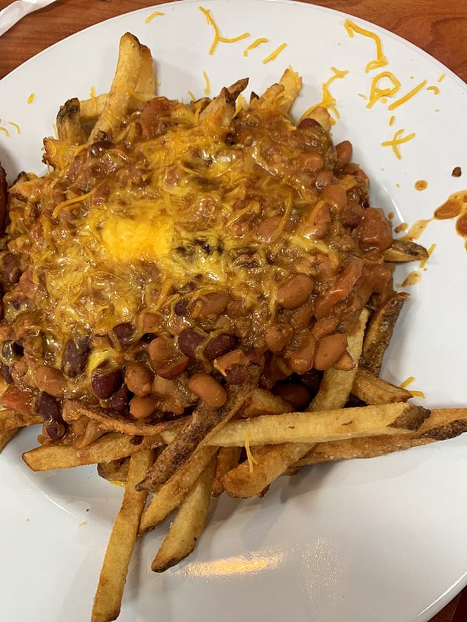 Chili fries: where comfort food goes to party. A magnificent mess that requires no apology, only a fork and possibly a moment of silent appreciation.