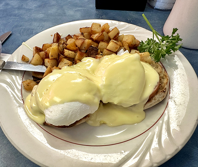 Eggs Benedict: where breakfast meets luxury. That hollandaise sauce flows like liquid gold over perfectly poached eggs.