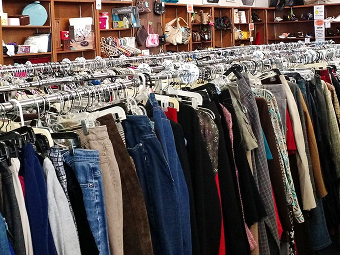 Clothing racks stretch endlessly, offering fashion possibilities from every decade and style preference imaginable.