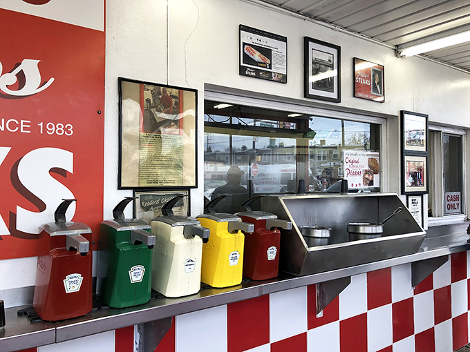 The condiment station&mdash;where personalization happens. Those colorful squeeze bottles hold the power to customize your sandwich destiny.