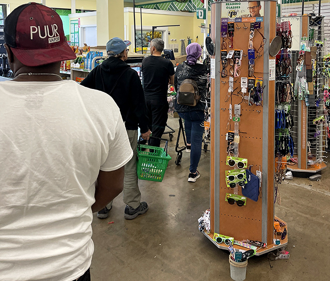 Green baskets become modern-day treasure chests as shoppers navigate the store, each aisle offering new possibilities for budget-friendly discoveries.