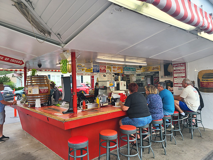 These counter seats have witnessed first dates, family outings, and solo travelers for generations. Each red stool holds stories that would fill volumes if they could talk.