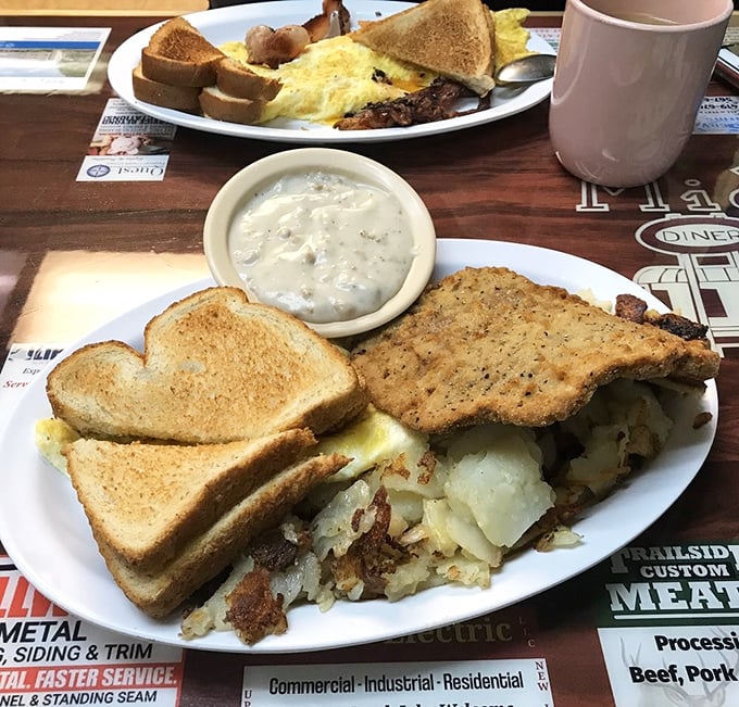 Country fried steak with gravy alongside eggs and potatoes&mdash;the kind of hearty plate that fuels farmers, factory workers, and food enthusiasts alike.