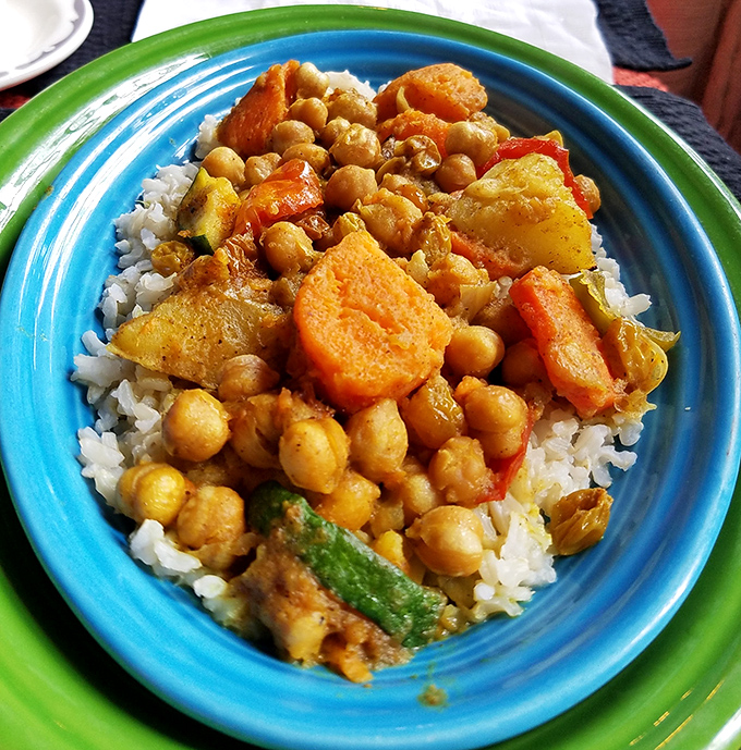 A curry that doesn't apologize for its boldness. Chickpeas and sweet potatoes nestled in spices that warm you from the inside out.