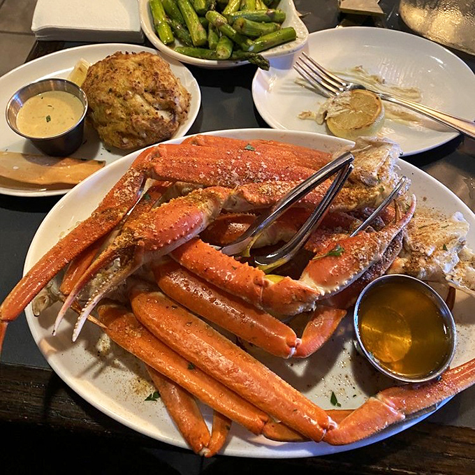 Sweet crab legs arrive ready for cracking, accompanied by golden butter that practically glows with possibility.