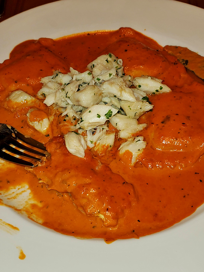 Orange sauce cascading over tender ravioli like a sunset over the Atlantic&mdash;with crabmeat playing the starring role in this coastal drama.