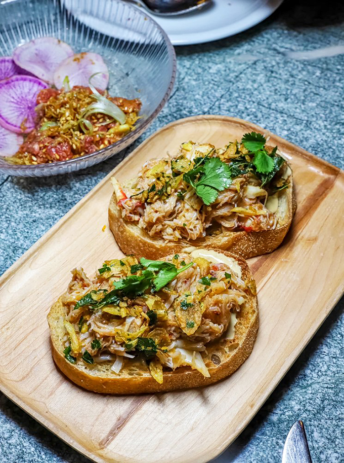 Crab toast that makes you wonder why we ever put anything else on bread. These golden morsels are what would happen if comfort food went to finishing school.