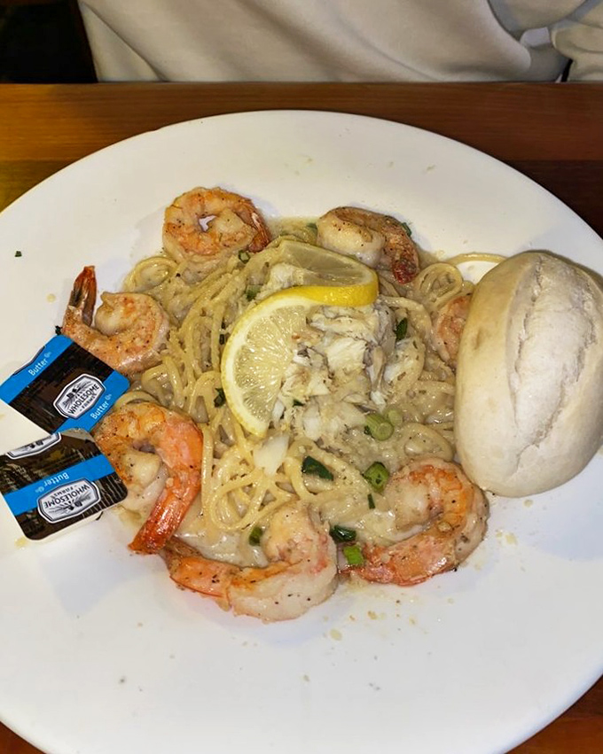 Shrimp pasta that hits all the right notes – tender seafood, al dente noodles, and a sauce that makes you want to request extra bread for sopping.