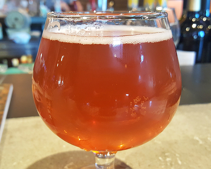 Local craft brews complement elevated comfort food in a pairing that feels perfectly natural together.