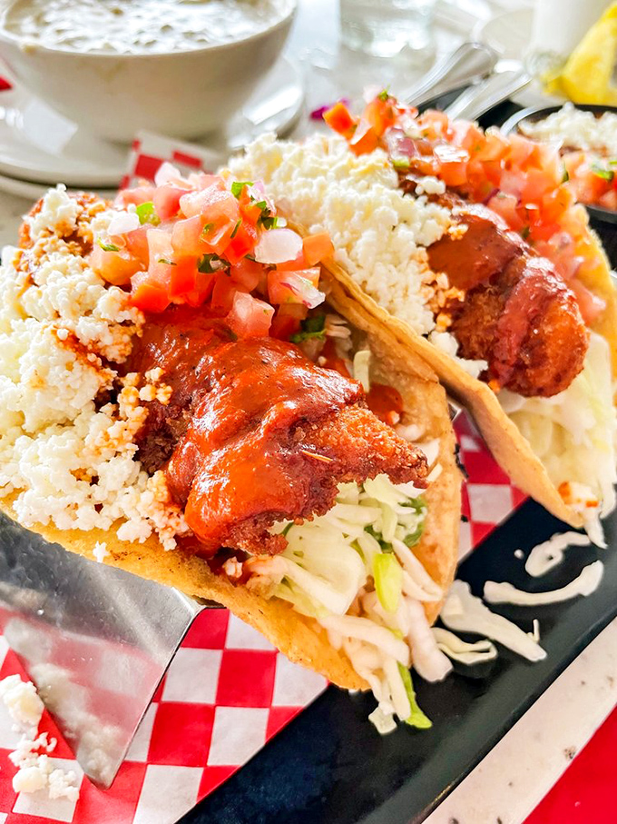 Fish tacos that make Tuesday special any day of the week. That crumbled cheese on top isn't just a garnish&mdash;it's the final perfect touch in a handheld masterpiece.