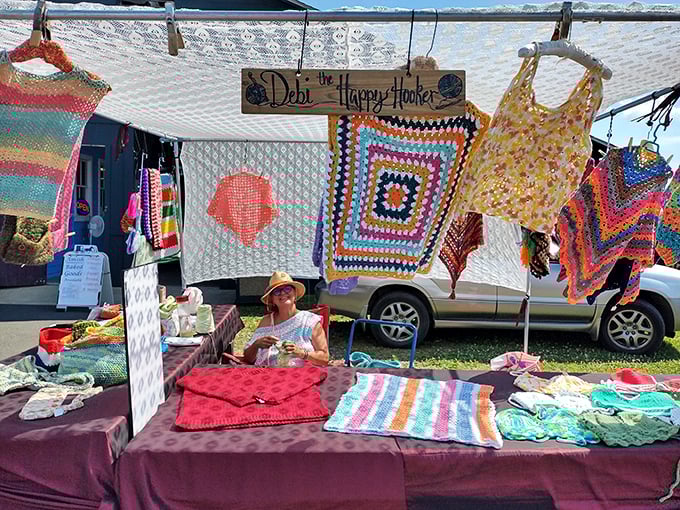 Handcrafted crochet creations hang like colorful flags of creativity. Each stitch represents hours of patience that your local big box store simply cannot replicate.