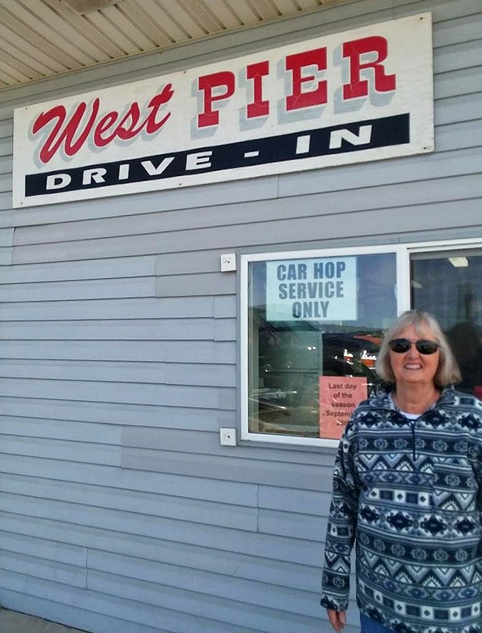 The drive-in's sign promises "Car Hop Service Only"&mdash;a delightful throwback to simpler times when good food came with a side of nostalgia.