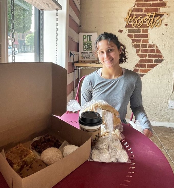 The joy of scoring the perfect pastry box is written all over this customer's face&mdash;a universal language of sweet anticipation.