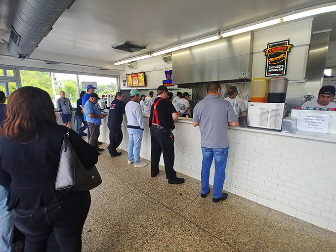 The great equalizer: everyone becomes family when waiting for hot dog nirvana.