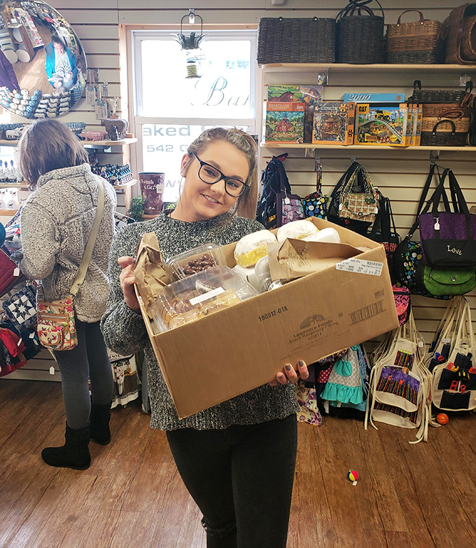 The universal "I hit the jackpot" smile of someone who's about to introduce their kitchen to Bird-in-Hand baked goods. That box contains more happiness than most Black Friday purchases.