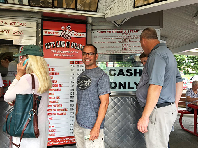 The ordering window&mdash;where dreams come true and diets go to die. Notice the wall of fame above, showcasing celebrity pilgrims to this cheesesteak mecca.