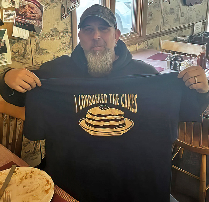The "I Conquered The Cakes" shirt is the local equivalent of summiting Everest&mdash;a badge of honor for those brave enough to tackle their legendary pancake challenge.