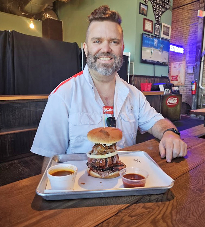 That smile says it all &ndash; the face of someone who's just discovered the meaning of life between two buns and a pile of smoked meat.