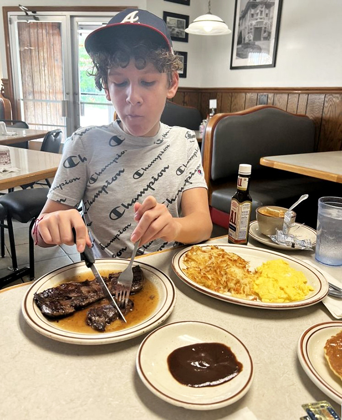 Watching a young diner tackle steak and eggs with the concentration of a neurosurgeon&mdash;childhood breakfast memories in the making.