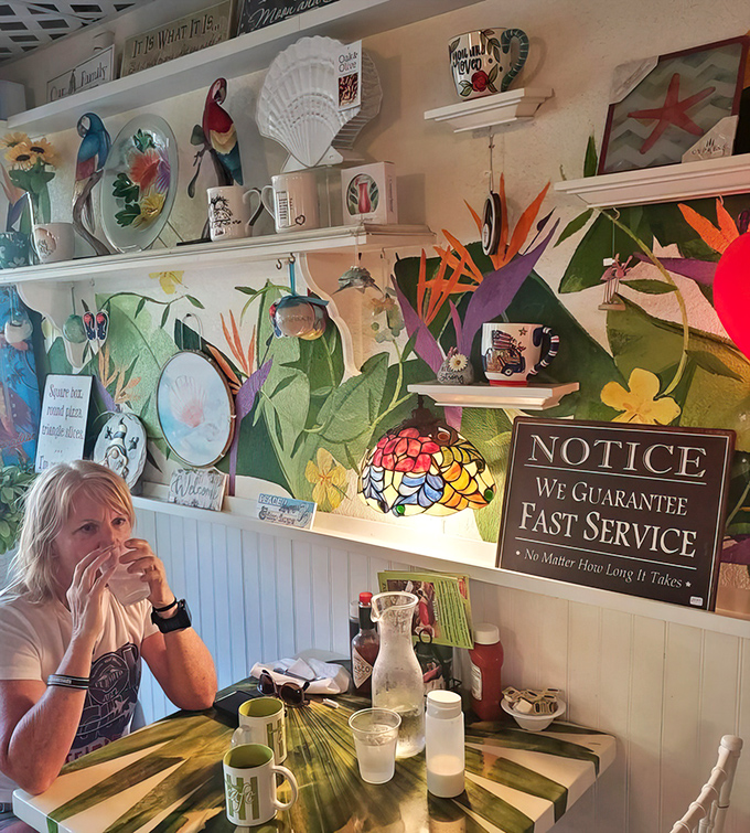 Walls adorned with tropical treasures and a sign promising "fast service no matter how long it takes"&mdash;the kind of humor that pairs perfectly with coffee.