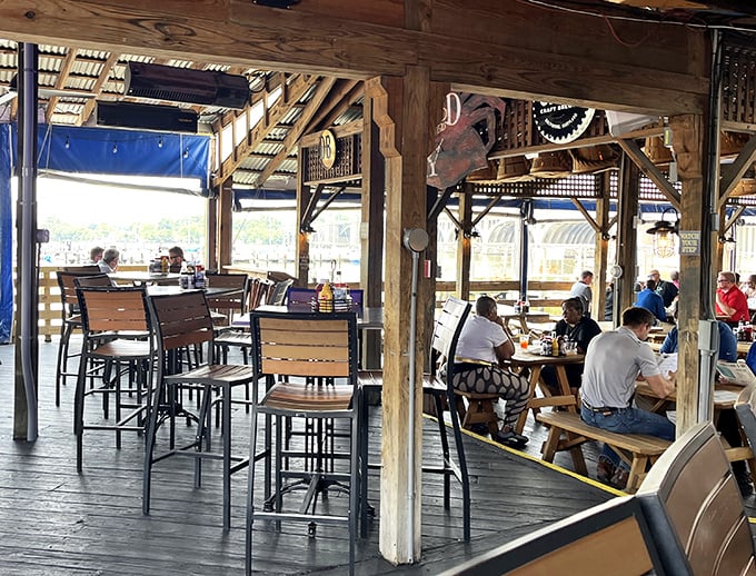 The covered deck at Nick's isn't just outdoor seating &ndash; it's Baltimore's living room, where strangers become friends over steamed crabs and cold beer.